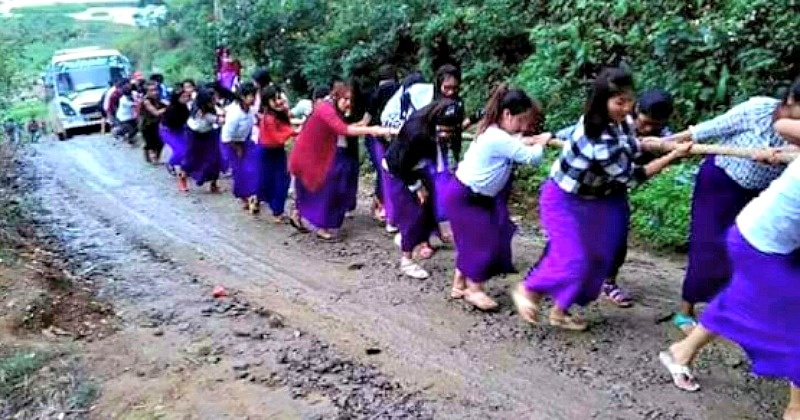 Photo Of Manipur School Girls Forming Human Chain To Pull Bus Stuck In ...