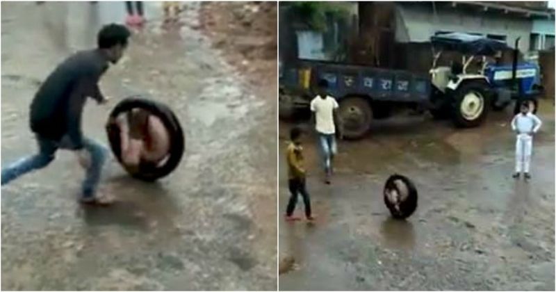 This Kid Rolling Down The Road Inside Of A Tyre Is Making The Best Use ...